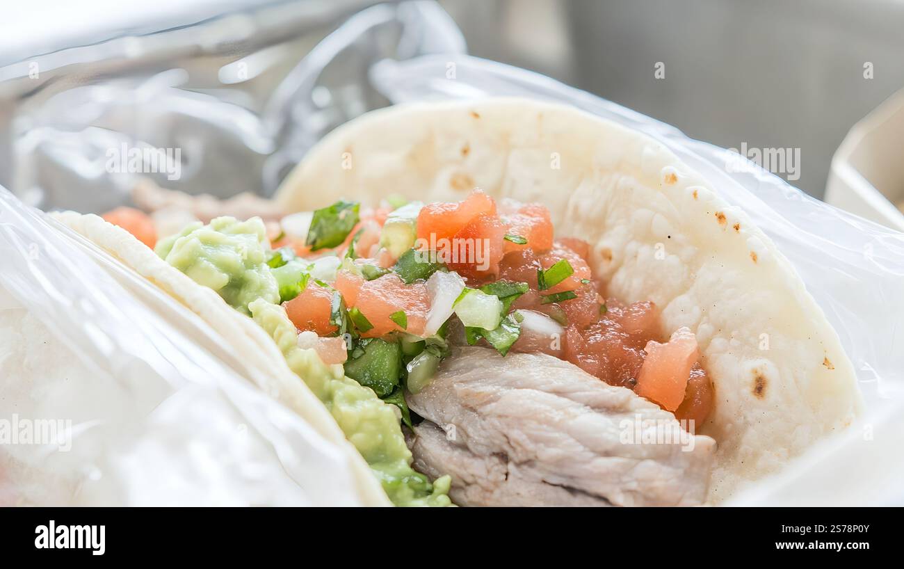 Closeup shot of a freshly prepared taco filled with a vibrant blend of ...