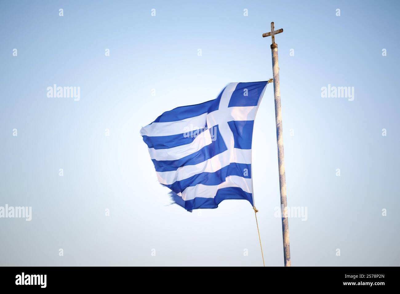 An image of the greek flag under a blue sky Stock Photo - Alamy