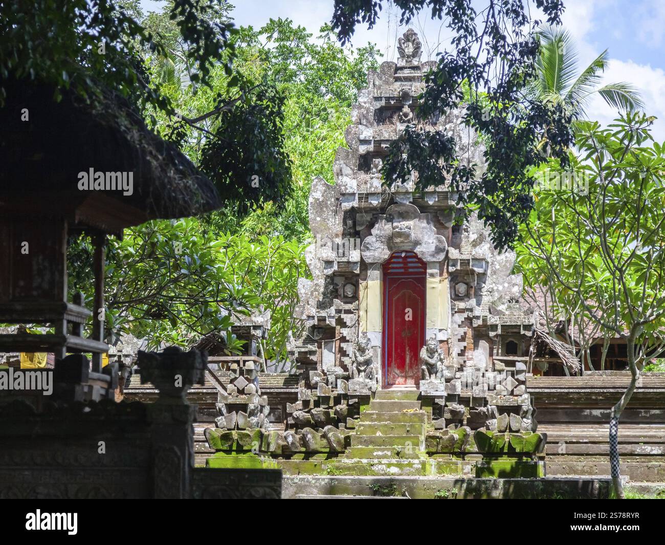 Steps and entrance door of an historic stone Hindu temple in Bali ...