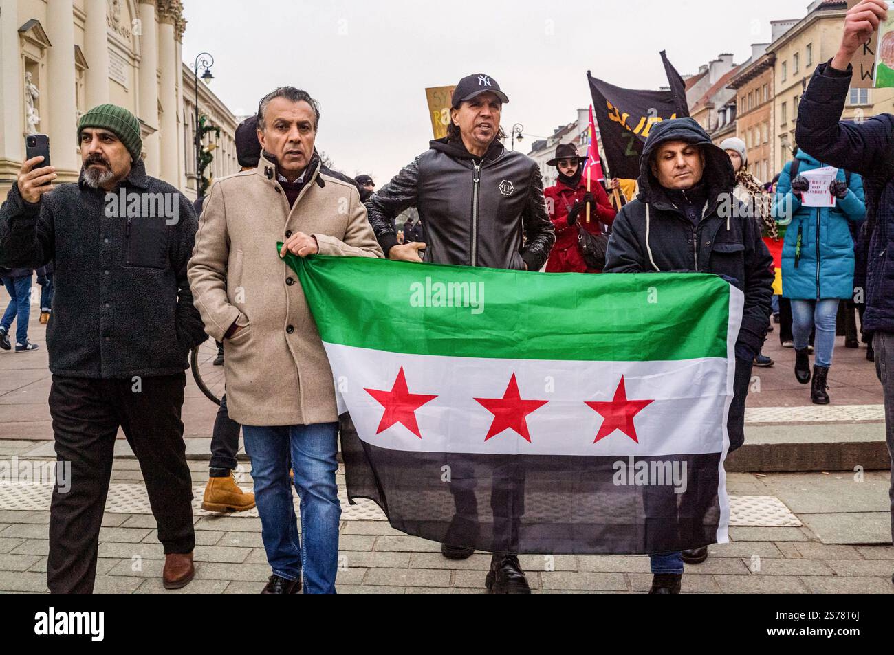Protestors march with the Syrian flag. In solidarity with the Syrian ...