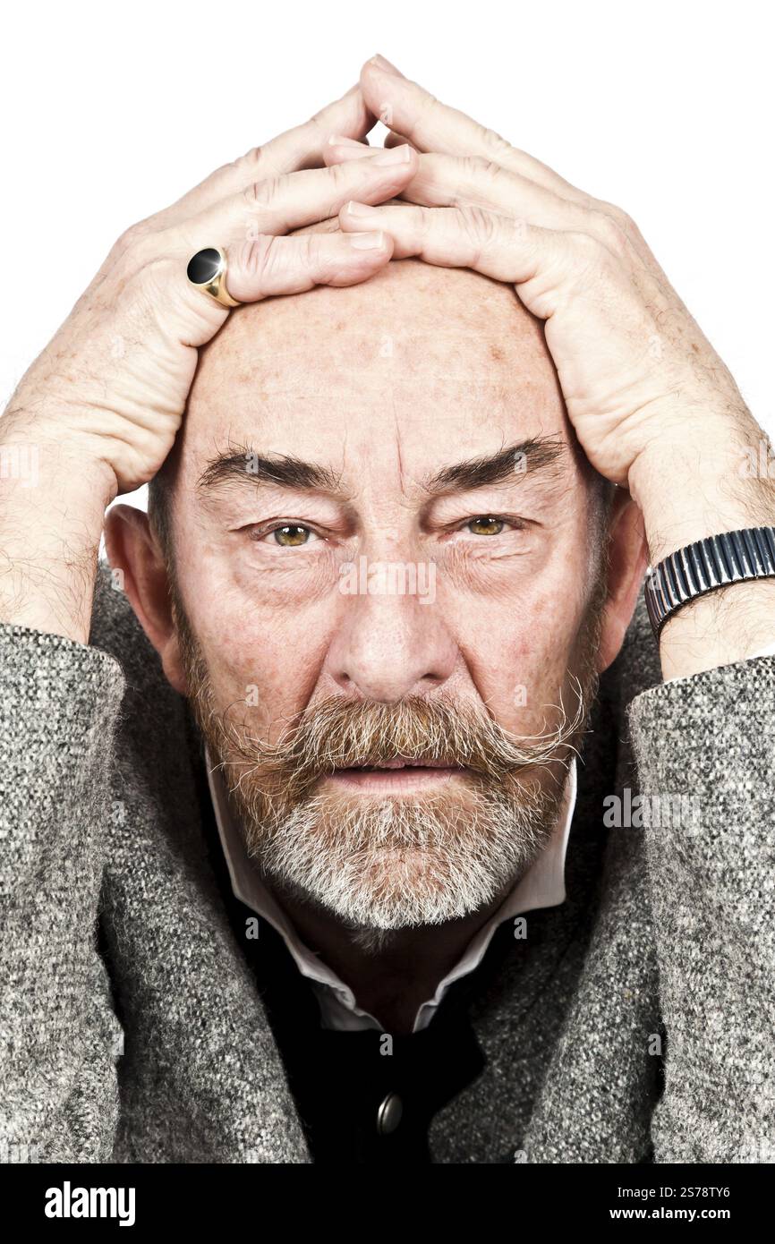 An old man with a grey beard is hopeless Stock Photo - Alamy