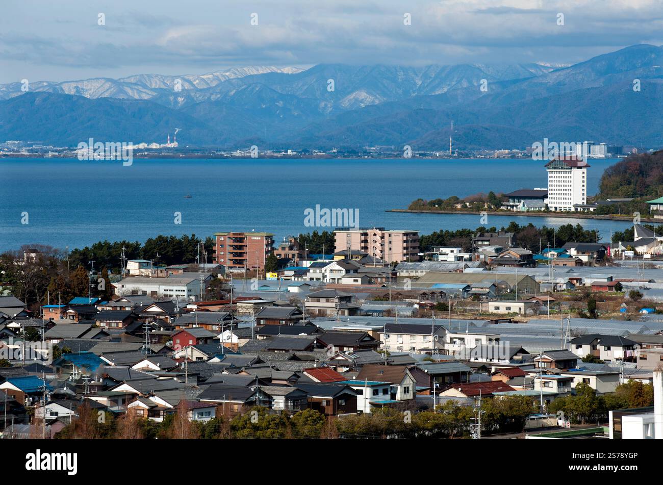 Bird's-eye view of Hikone city with Lake Biwa and distant mountain ...