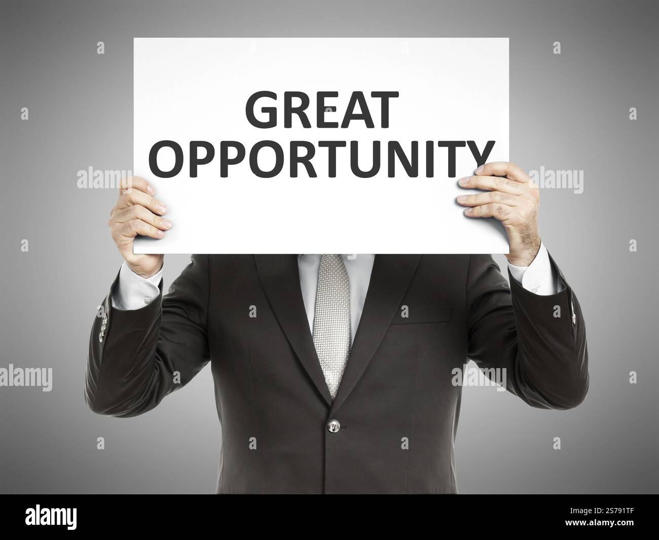 A business man holding a paper in front of his face with the text great ...