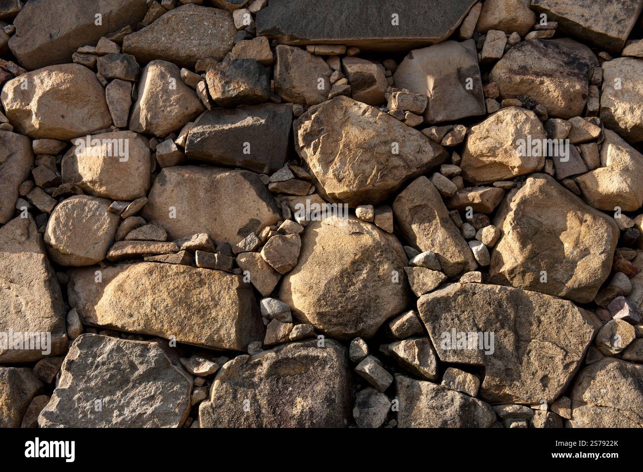 Detail of large and small rocks without mortar or cement making up the ...