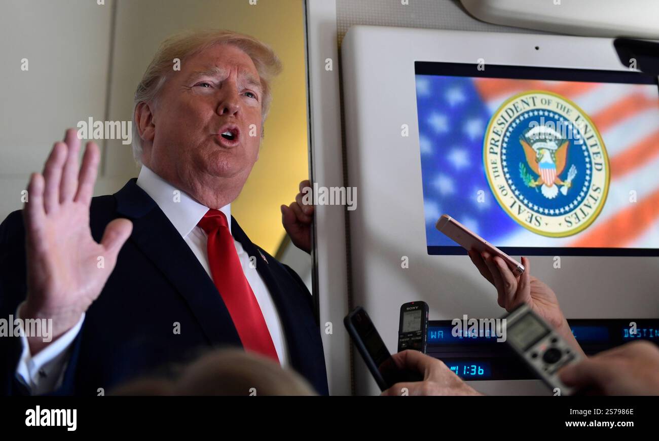 FILE - President Donald Trump talks to reporters while in flight from ...