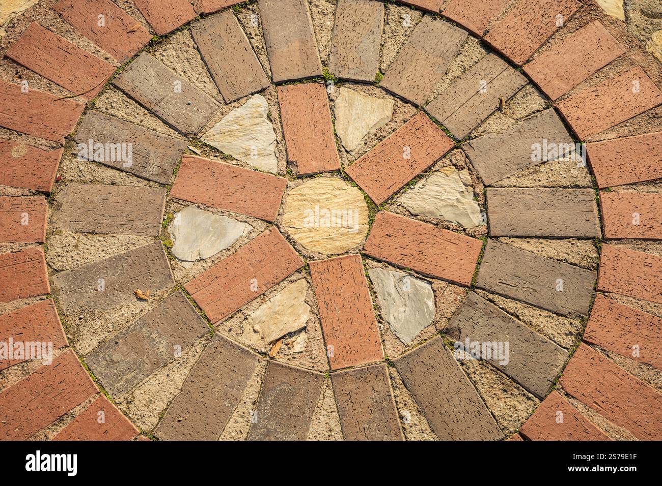 Circular brick and stone mosaic with concentric patterns Stock Photo ...