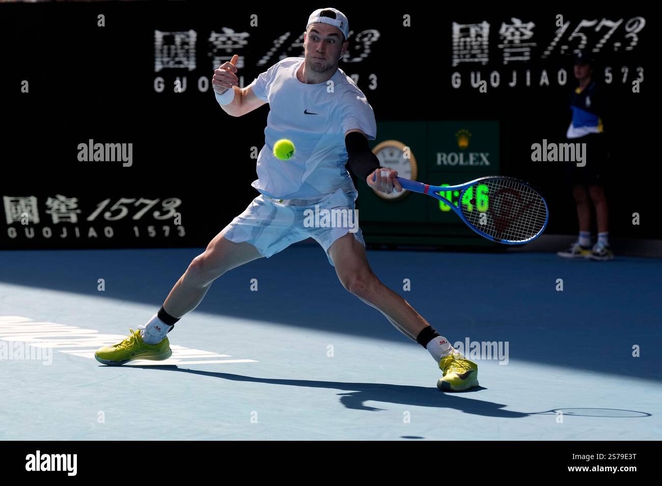 Jack Draper of Britain returns a shot from Carlos Alcaraz of Spain ...