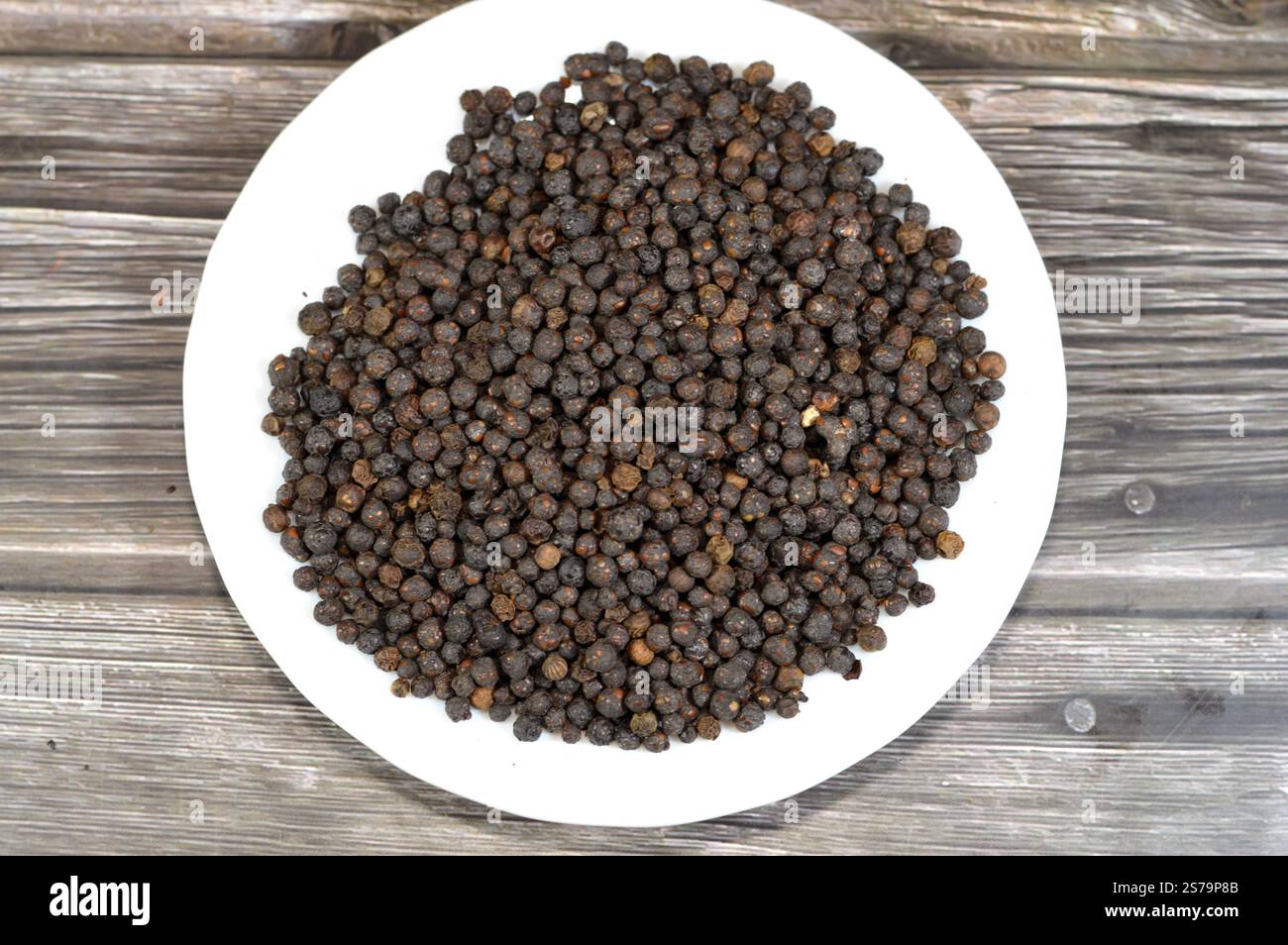 Black pepper (Piper nigrum), a flowering vine in the family Piperaceae ...