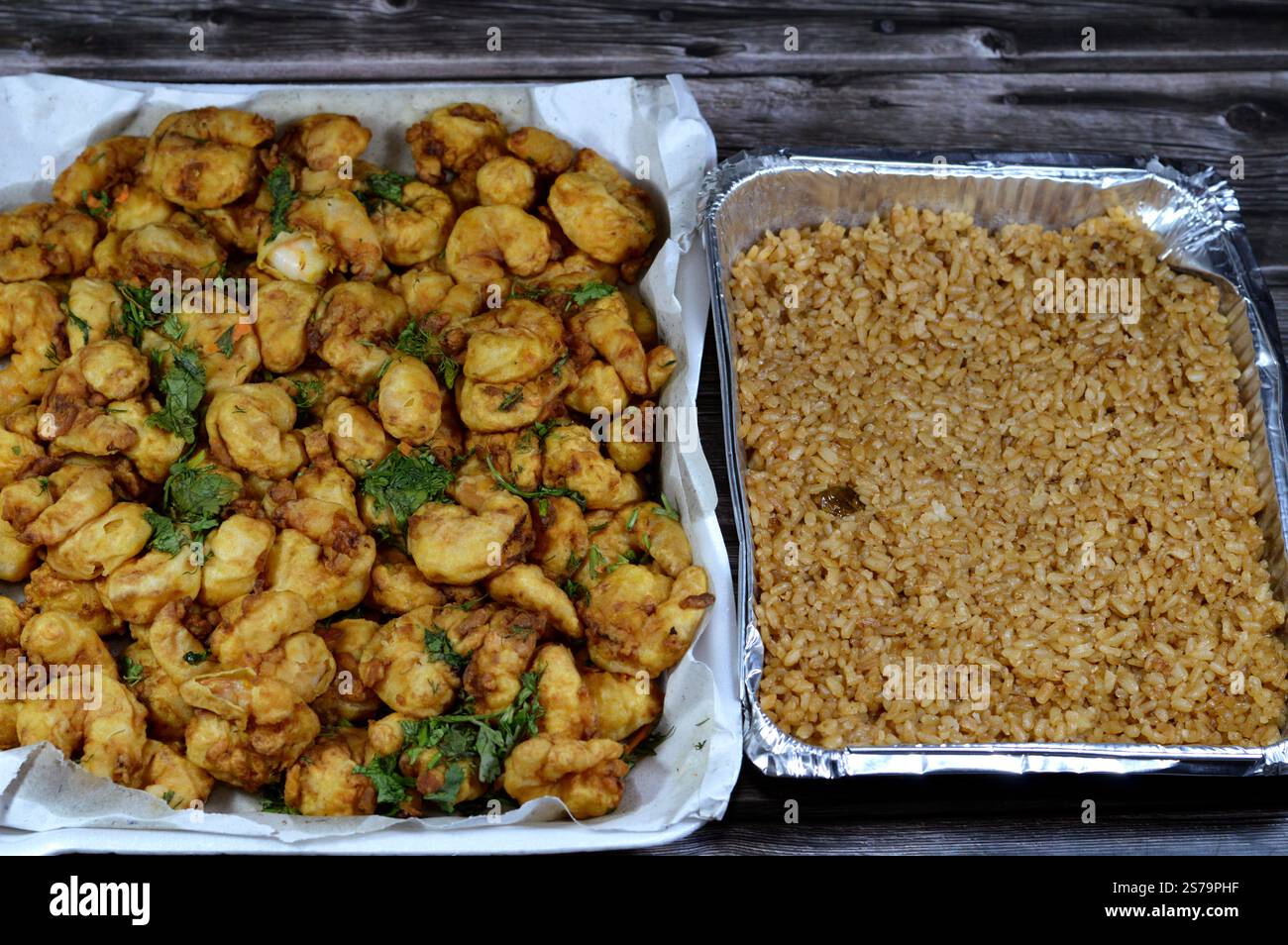 Red fish rice with fried shrimps covered with flour and fried in deep ...