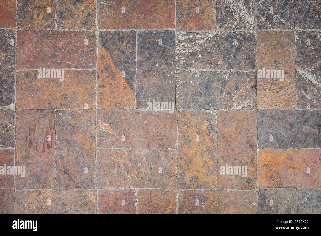 Rustic stone tile surface with natural texture and earth tones Stock ...