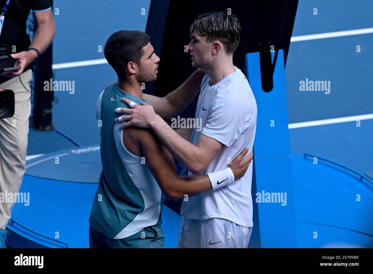 Melbourne, Australia. 19th Jan, 2025. Jack Draper of Great Britain (right) retires from his ...