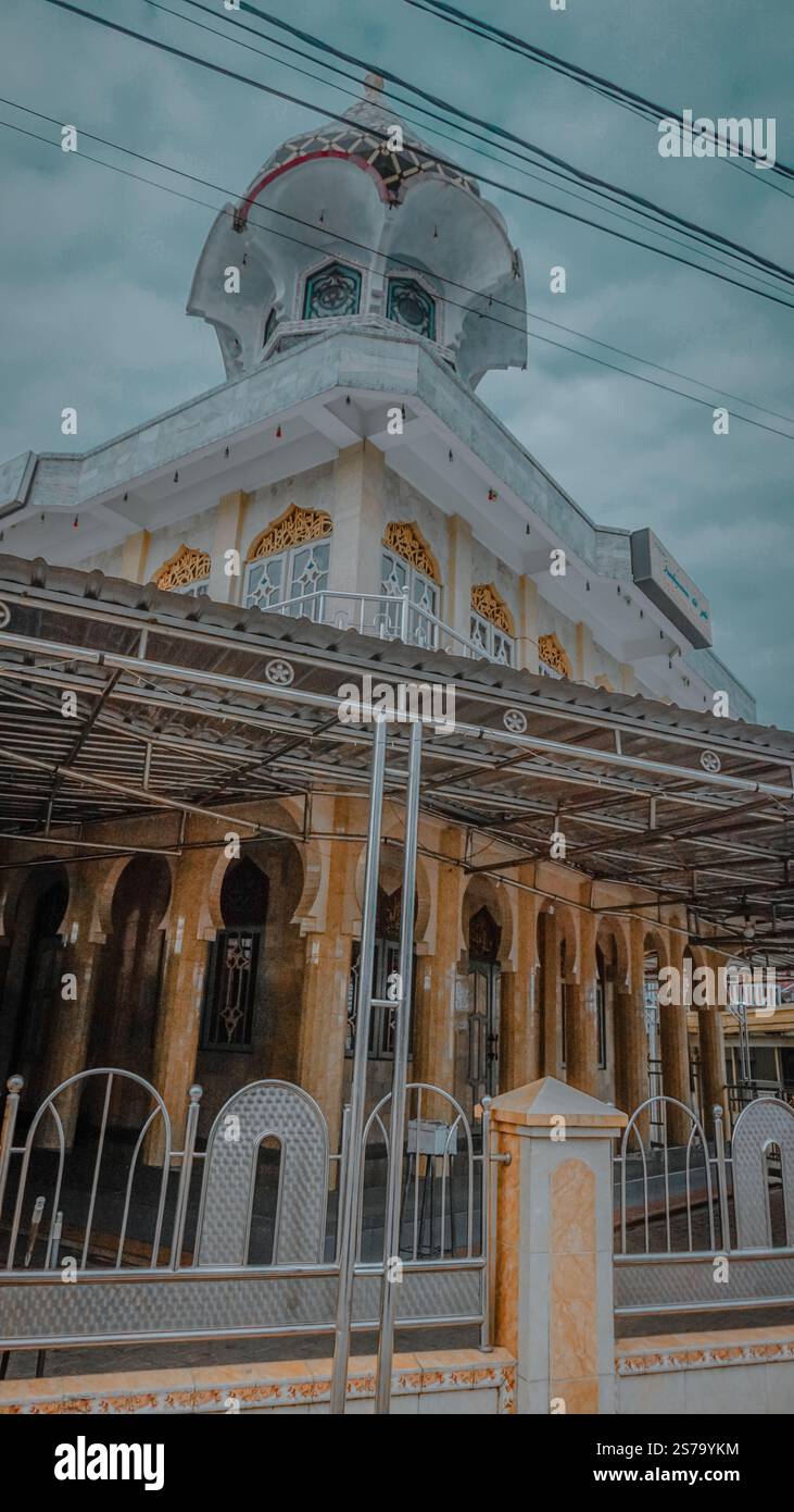 A mosque with a distinctive dome and ornate architectural details ...