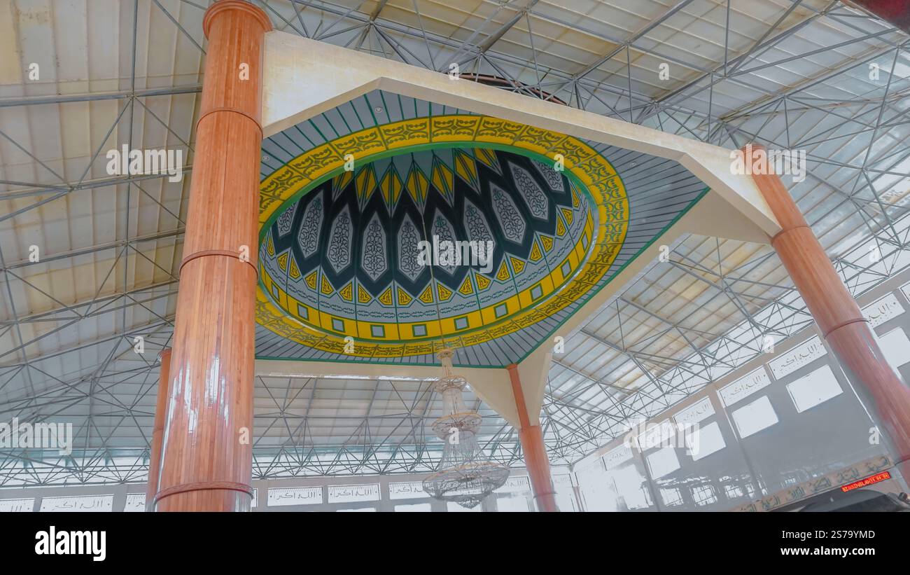 A large, intricately designed dome ceiling with geometric patterns and ...