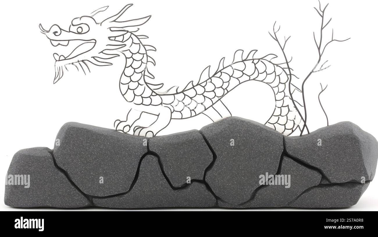 Weathered ancient Chinese dragon stone carving with moss and vines,a ...