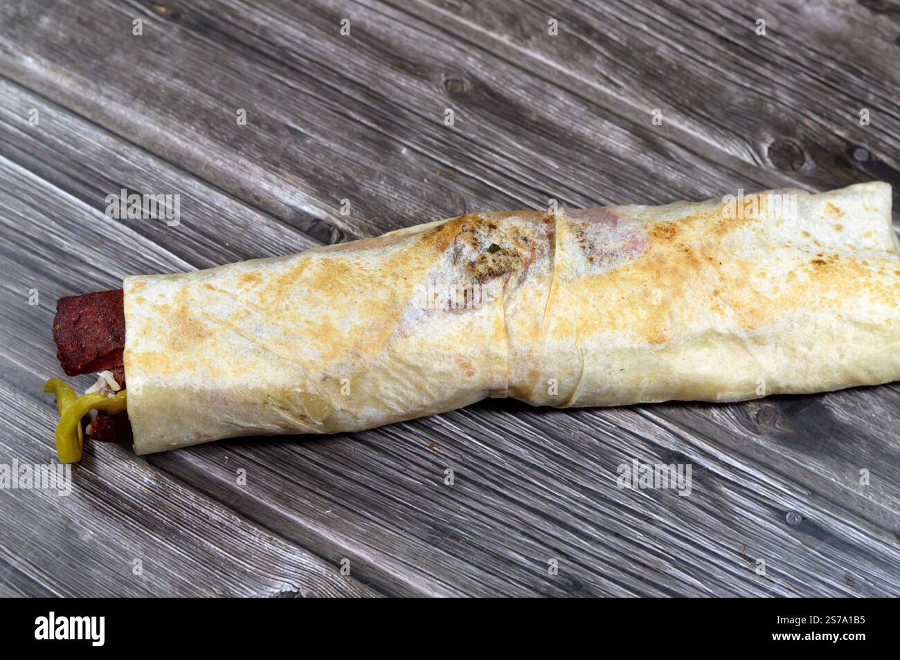 Oriental sausage shawerma or shawarma tortilla wrap with pickled ...