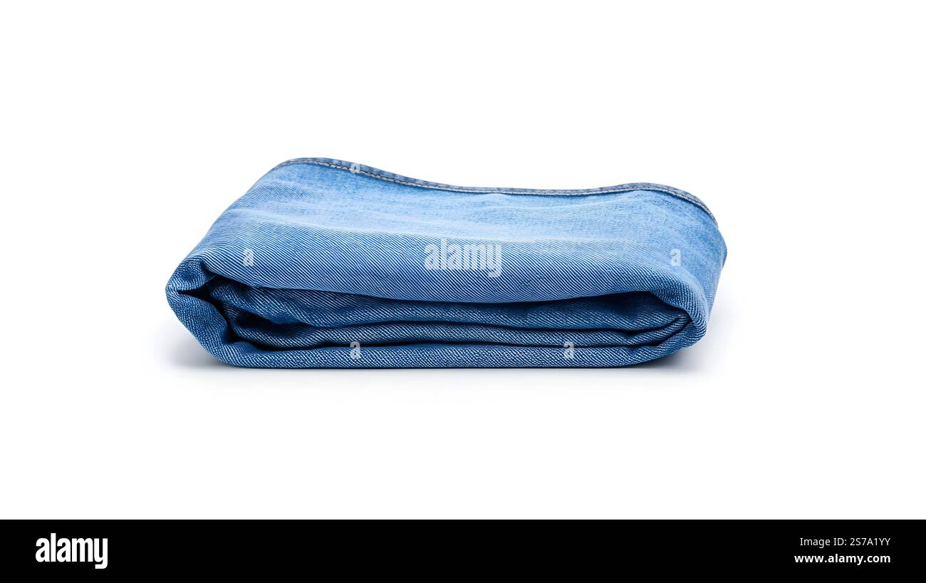 Folded denim jeans with visible stitching,isolated on a clean white ...