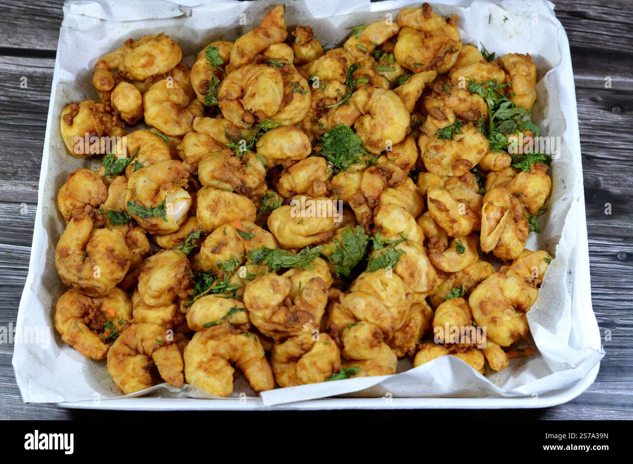 Fried shrimps covered with flour and fried in deep hot oil, shrimps are ...