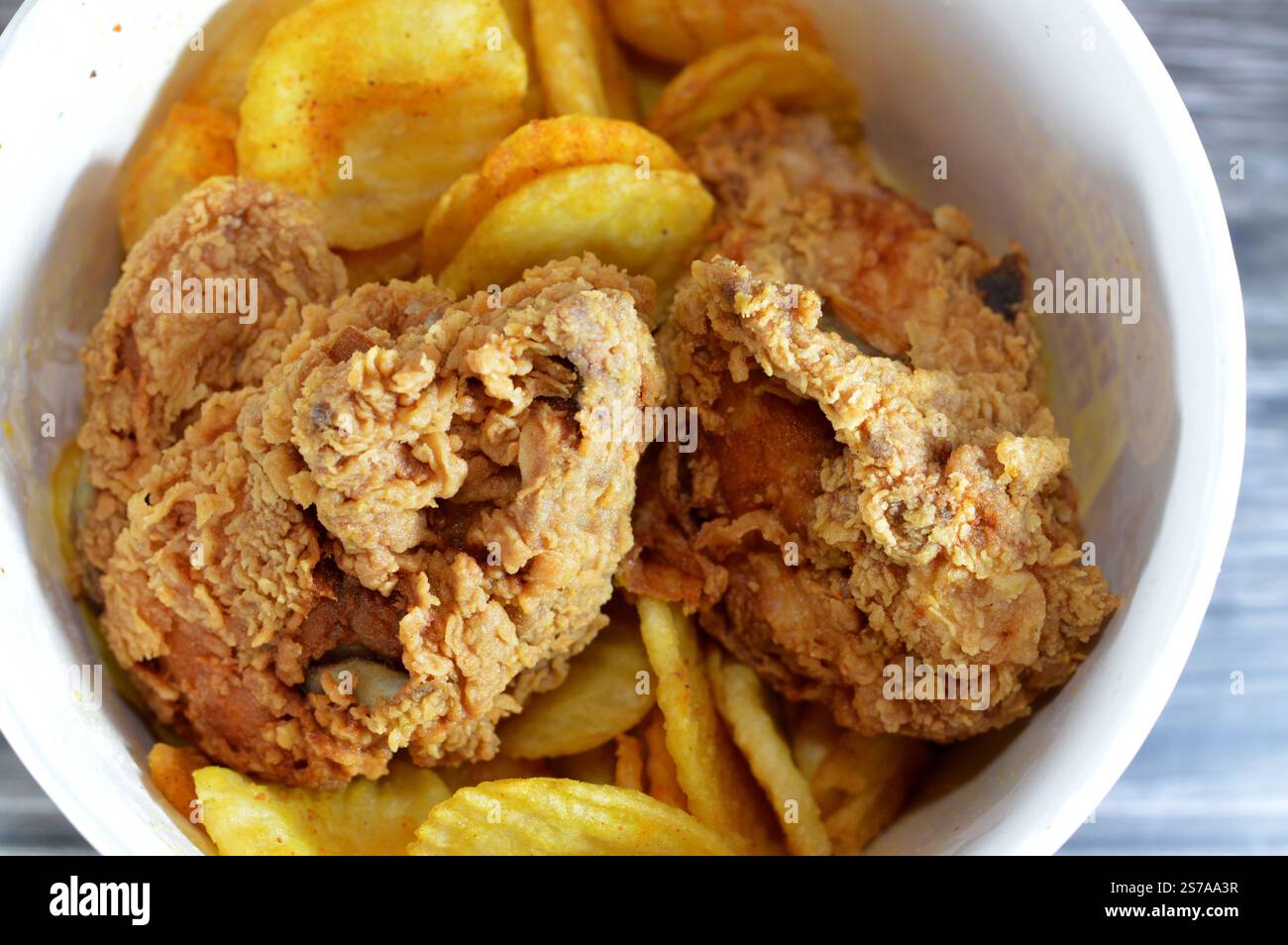 Broasted chicken meal with fried potato chips, a broast chicken pieces, Broasting is a special ...