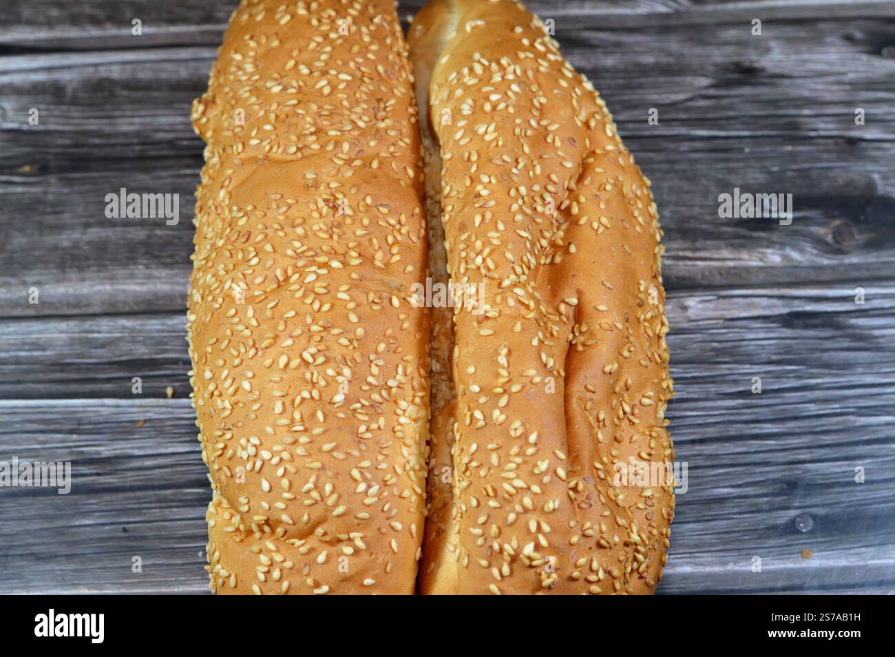 Long sesame bun bread, a fresh baked loaf of bread French Fino ready to ...