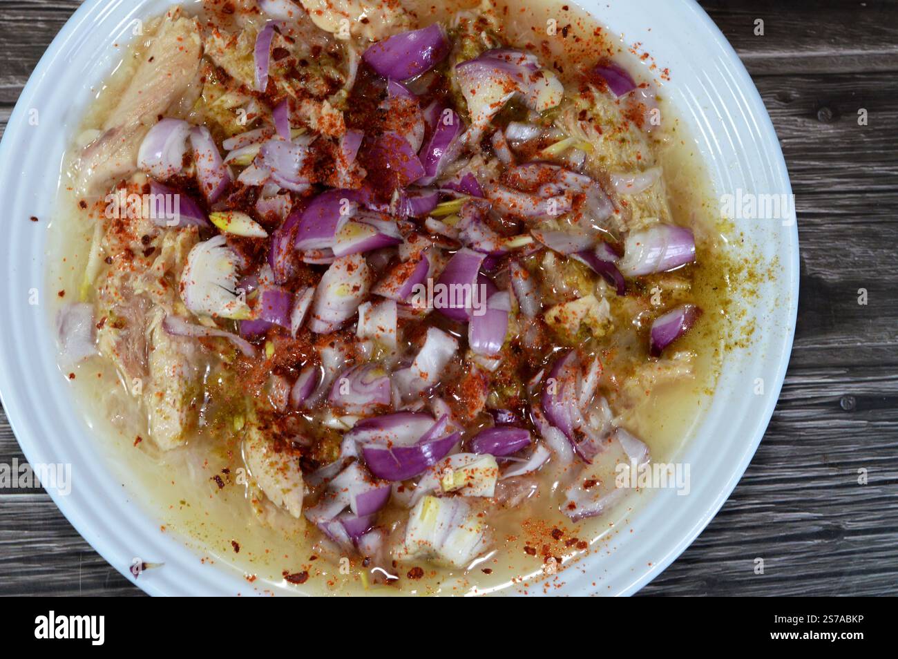 Tuna chunks with onions, Paprika and cumin in oil, Tuna is a saltwater ...