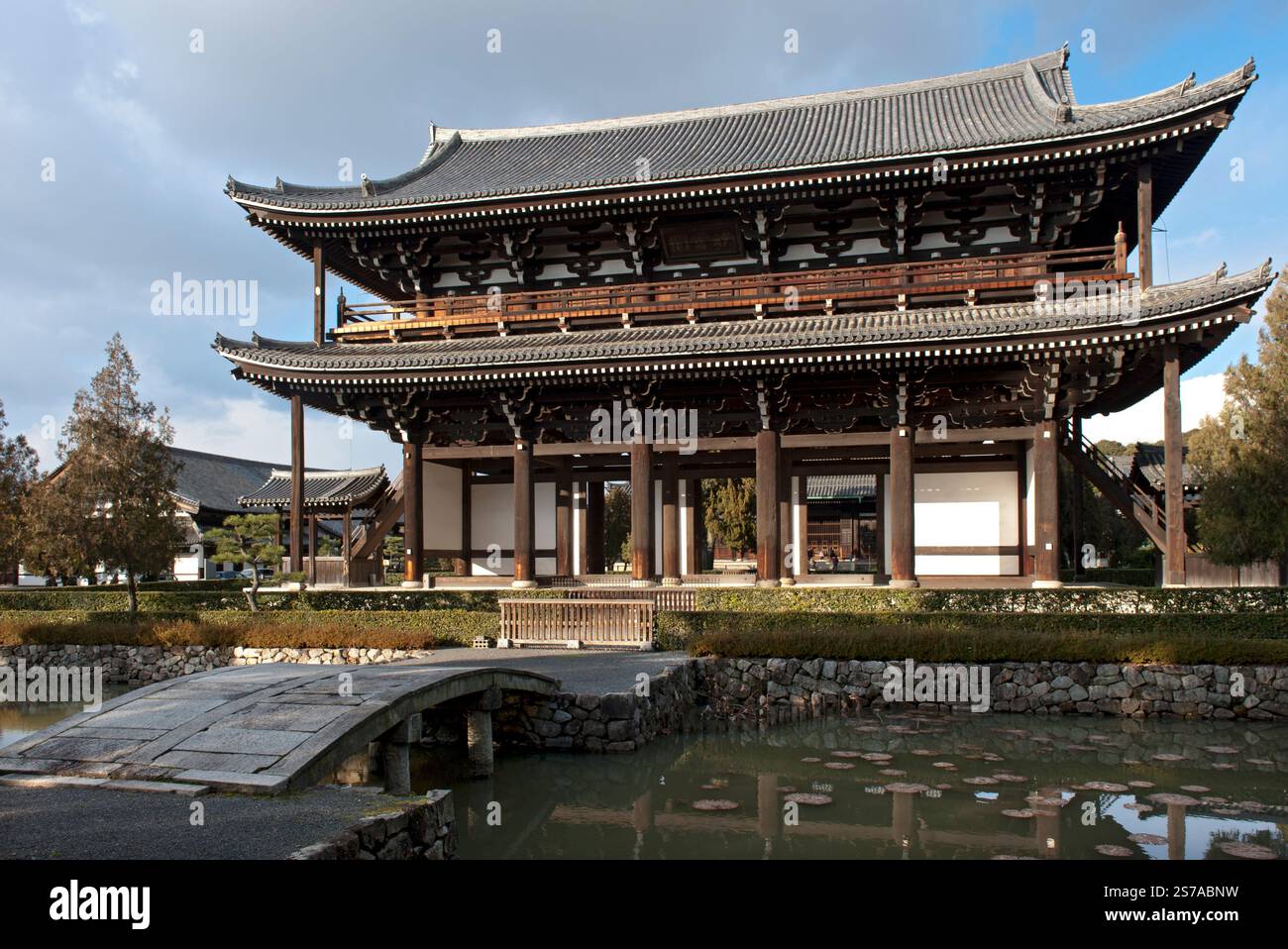 Shionchi fire reservoir pond with stone bridge and the massive Sanmon ...
