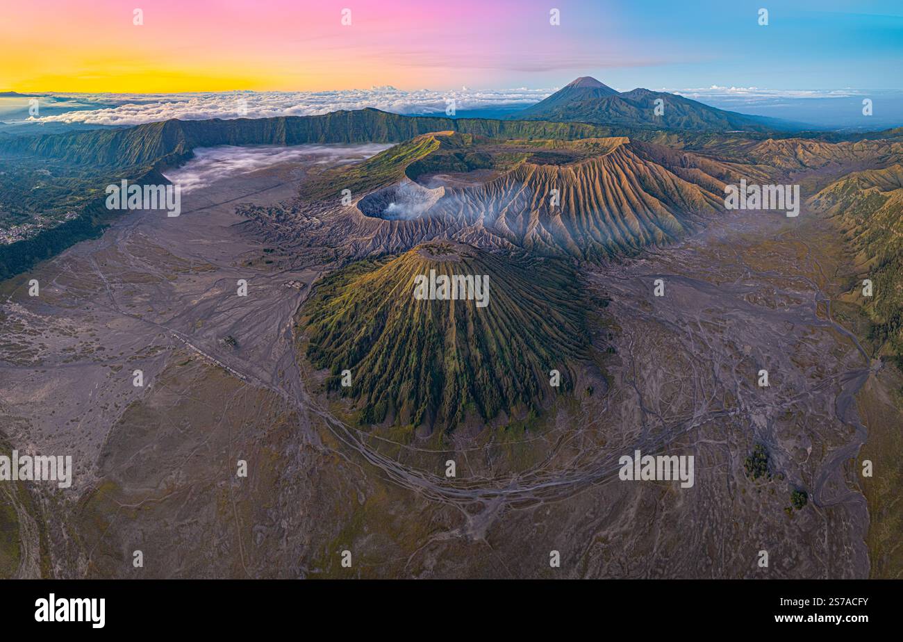 Aerial view morning sun splashing against the ridge of the Bromo volcano group.The white smoke ...