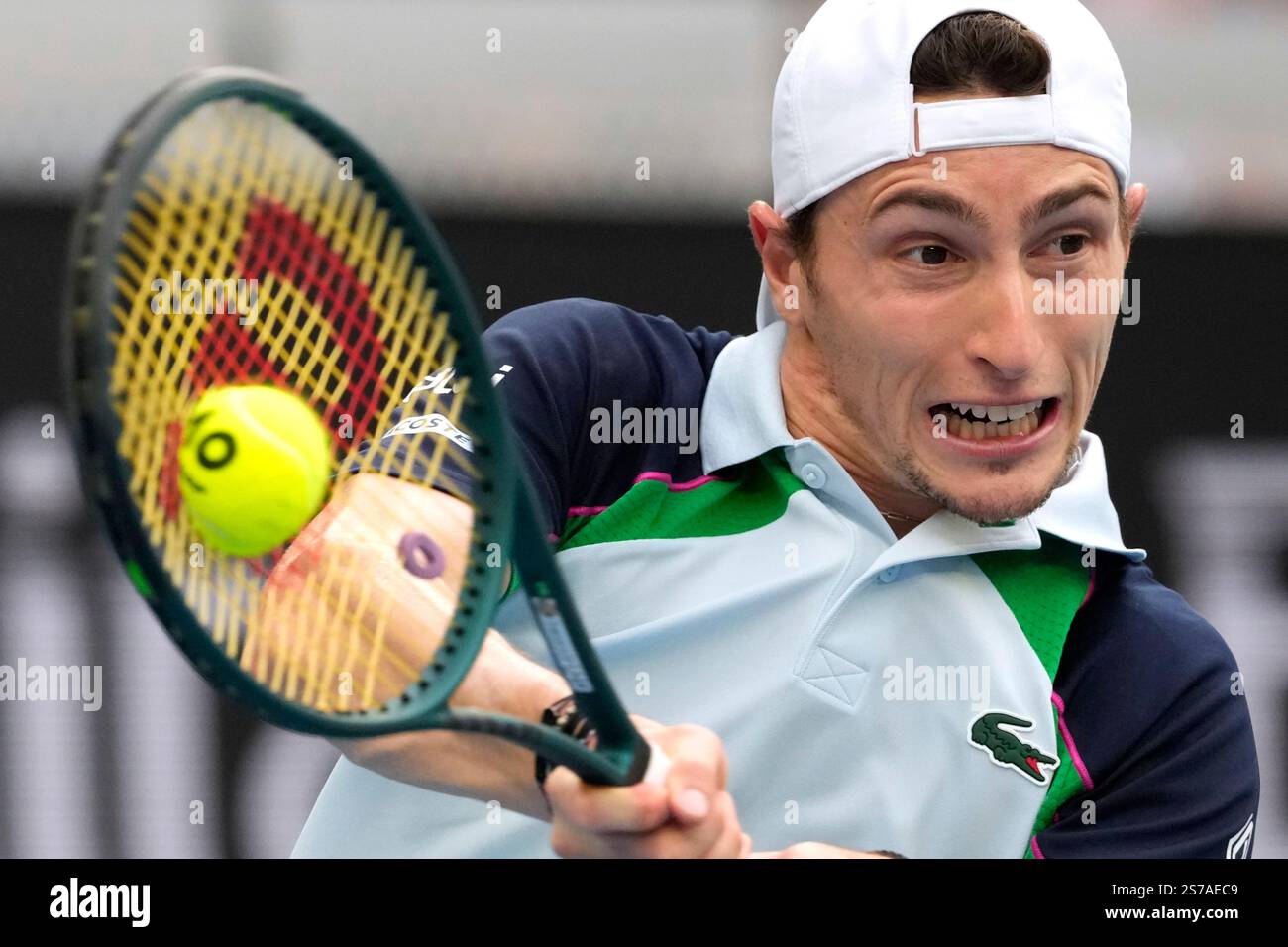 Ugo Humbert of France returns a shot from Alexander Zverev of Germany ...