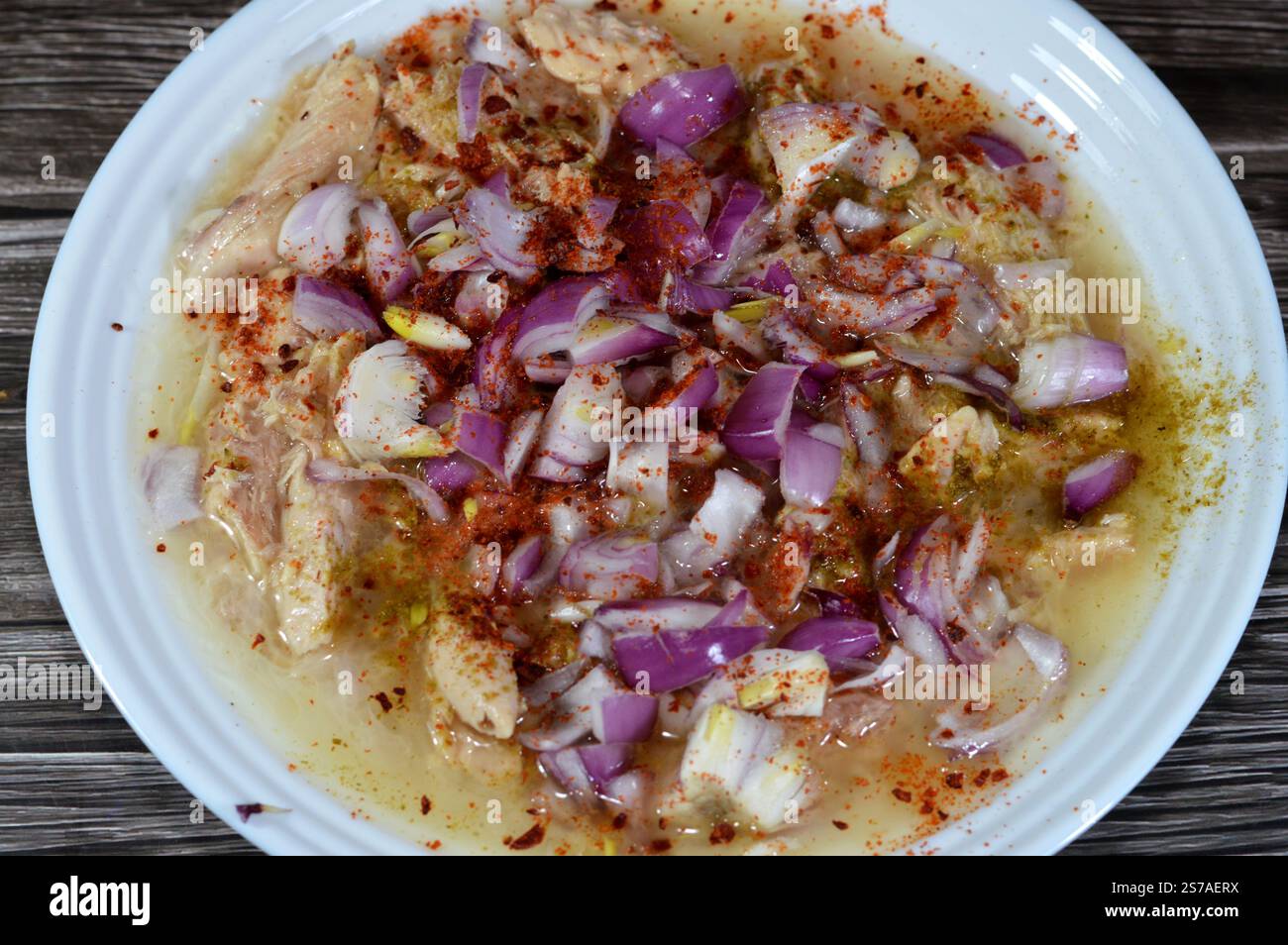 Tuna chunks with onions, Paprika and cumin in oil, Tuna is a saltwater ...