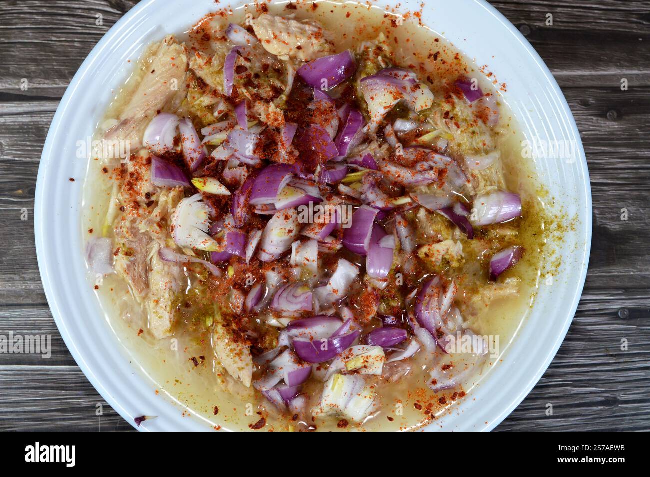 Tuna chunks with onions, Paprika and cumin in oil, Tuna is a saltwater ...