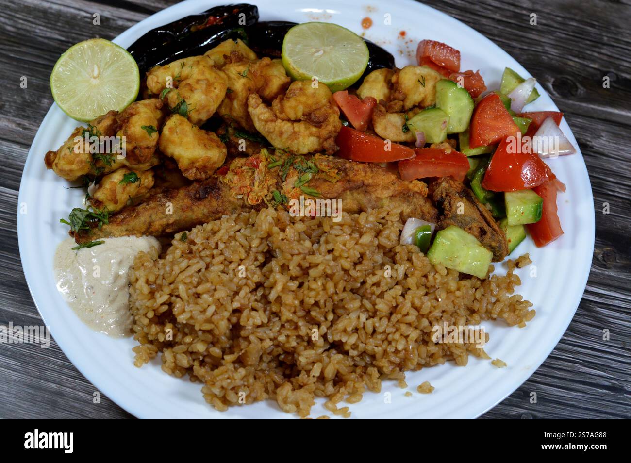 Mixed seafood of fried Saurida undosquamis, the brushtooth lizardfish ...