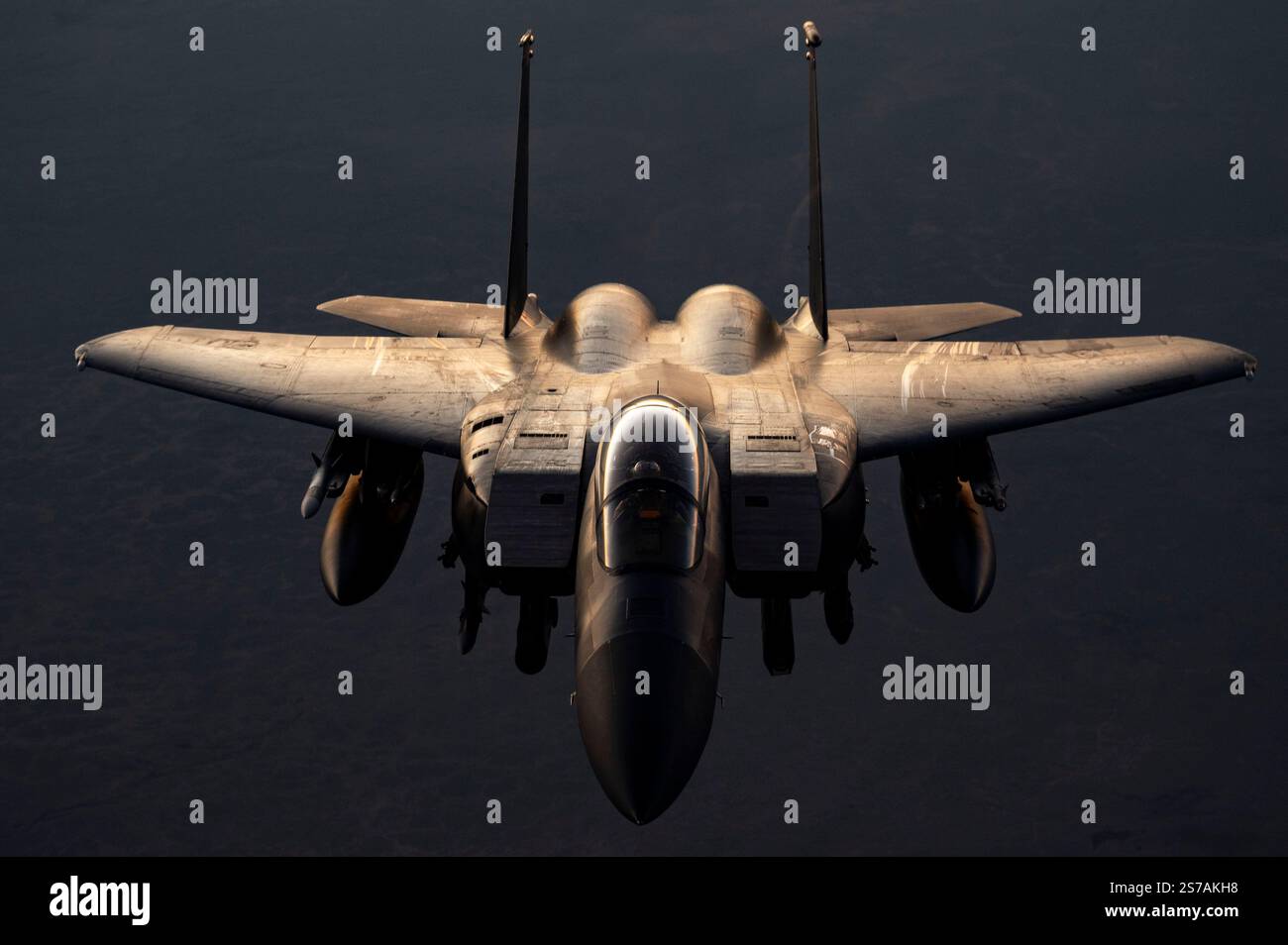 A U.S. Air Force F-15E Strike Eagle flies over the U.S. Central Command ...