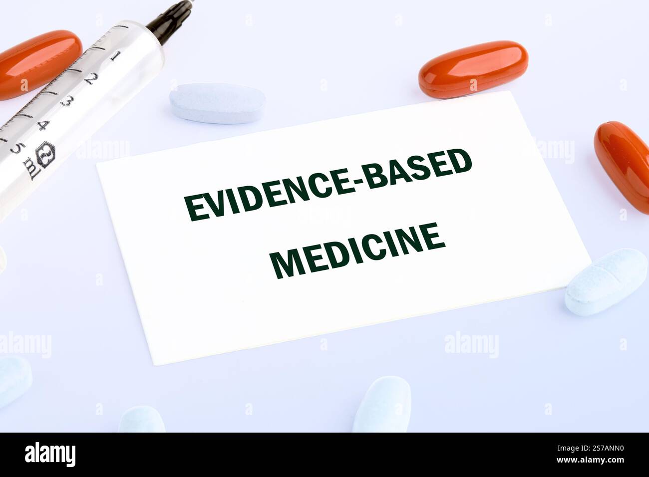Concept of evidence based medicine is emphasized with medications and a syringe, highlighting ...
