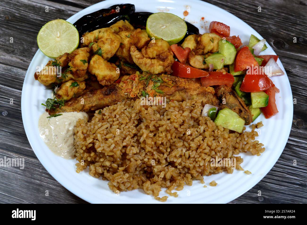 Mixed seafood of fried Saurida undosquamis, the brushtooth lizardfish ...