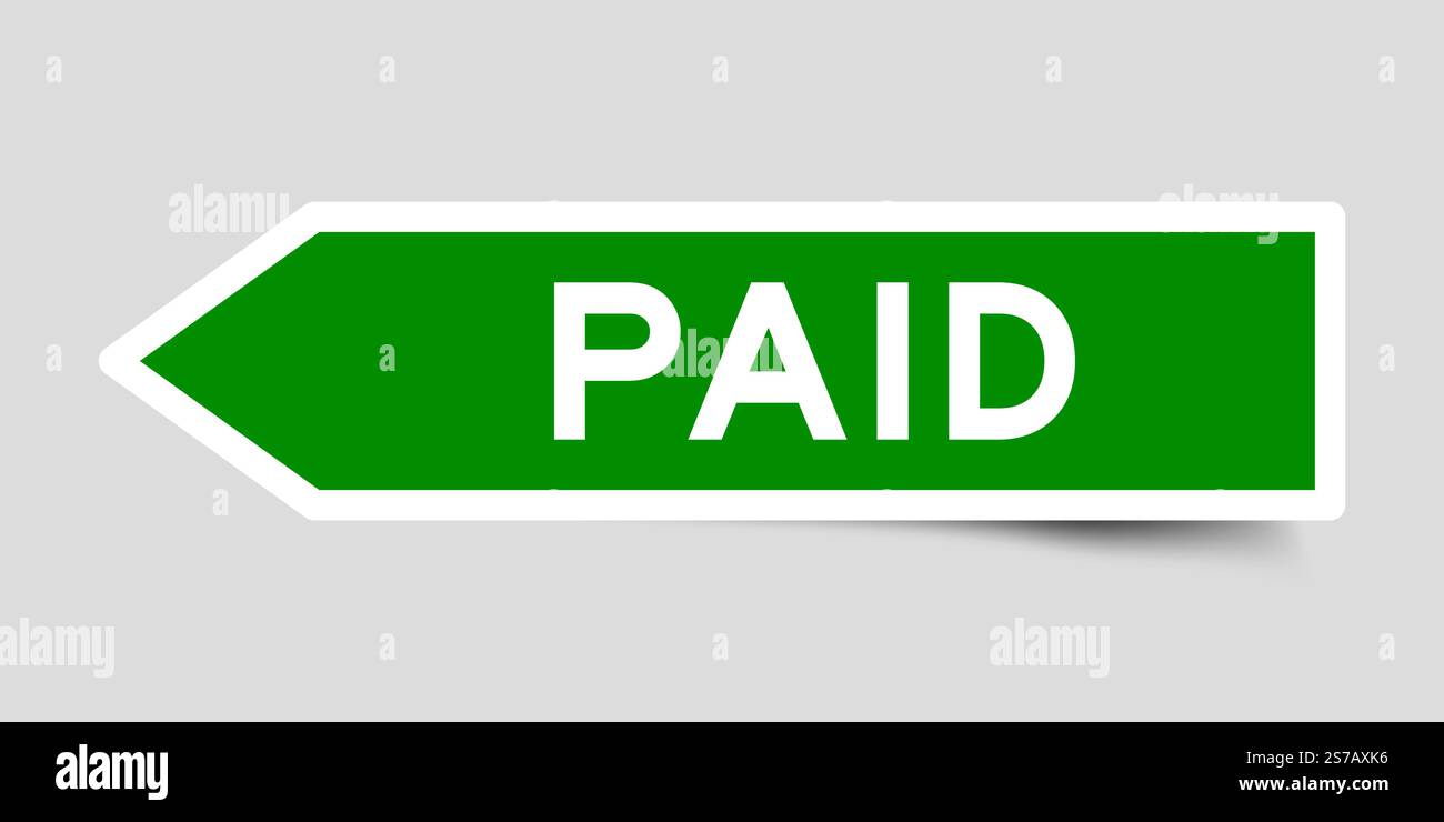 Green color arrow shape sticker label with word paid on gray background ...
