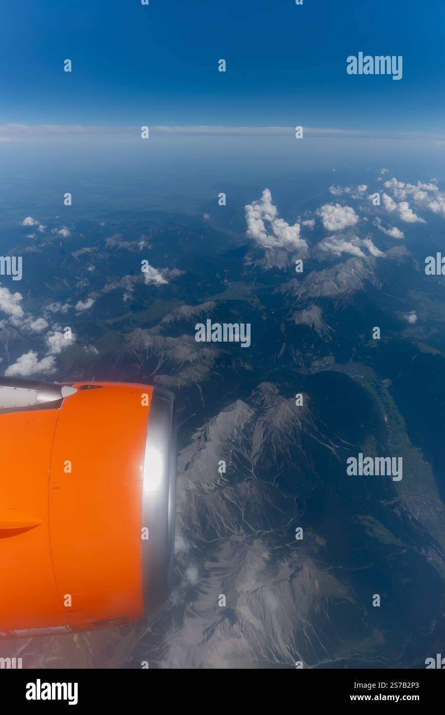 Europe- in flight- August 14 2024; Orange colour airplane engine cover ...