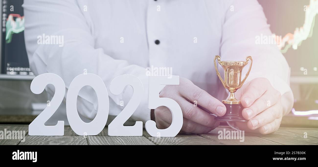 2025 business achievement and success concept: hands holding golden ...