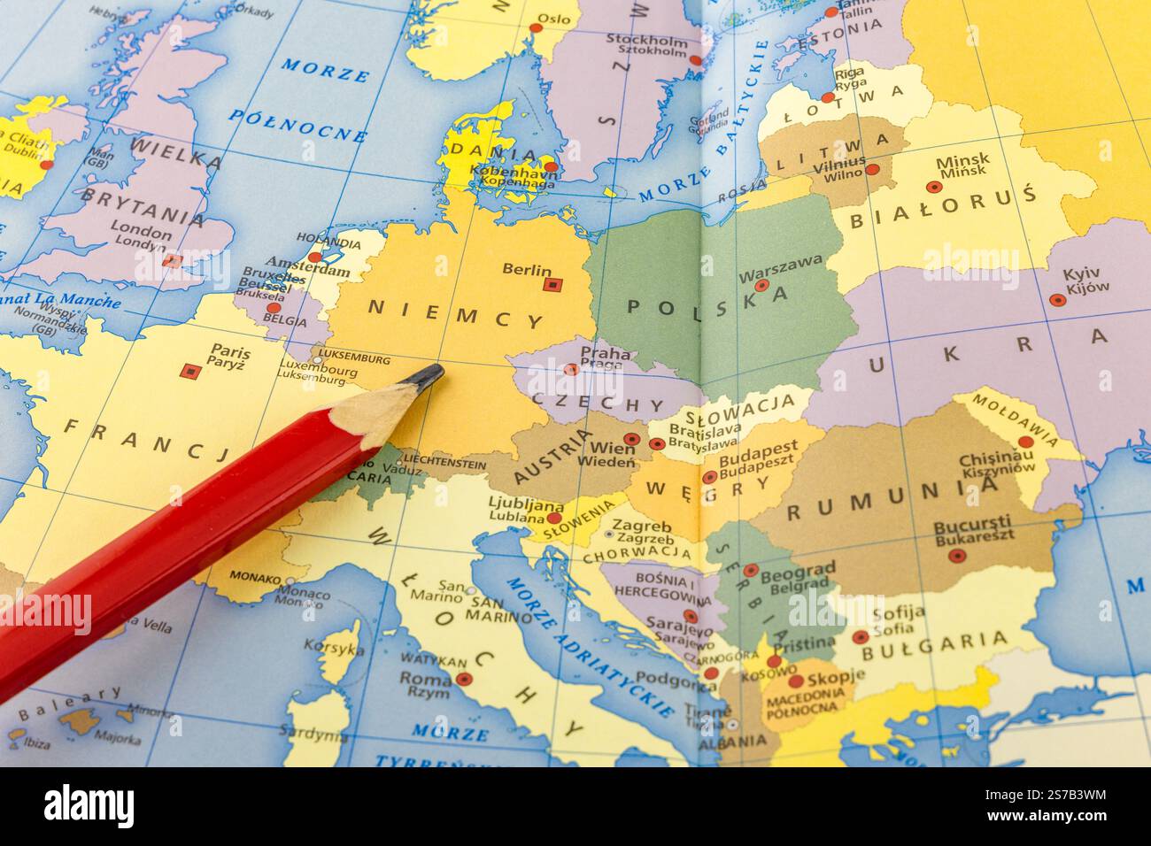 Drawing a travel route around Europe, red pencil, pointer on the map ...