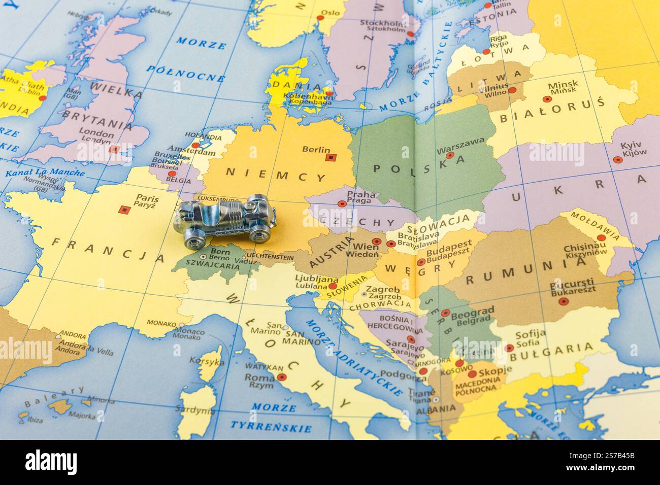 Germany driving route, small metal toy car located on a colorful map ...