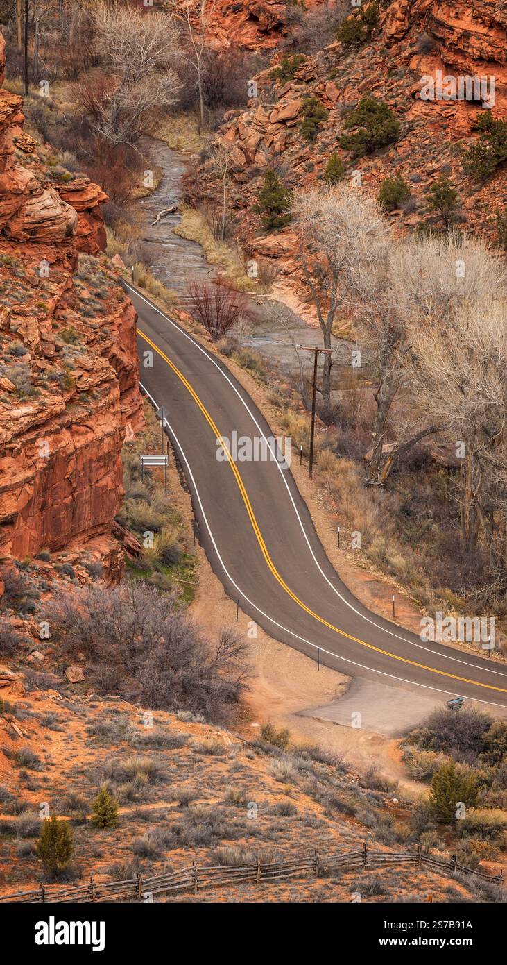 A winding road in Utah stretches through a breathtaking rocky landscape ...