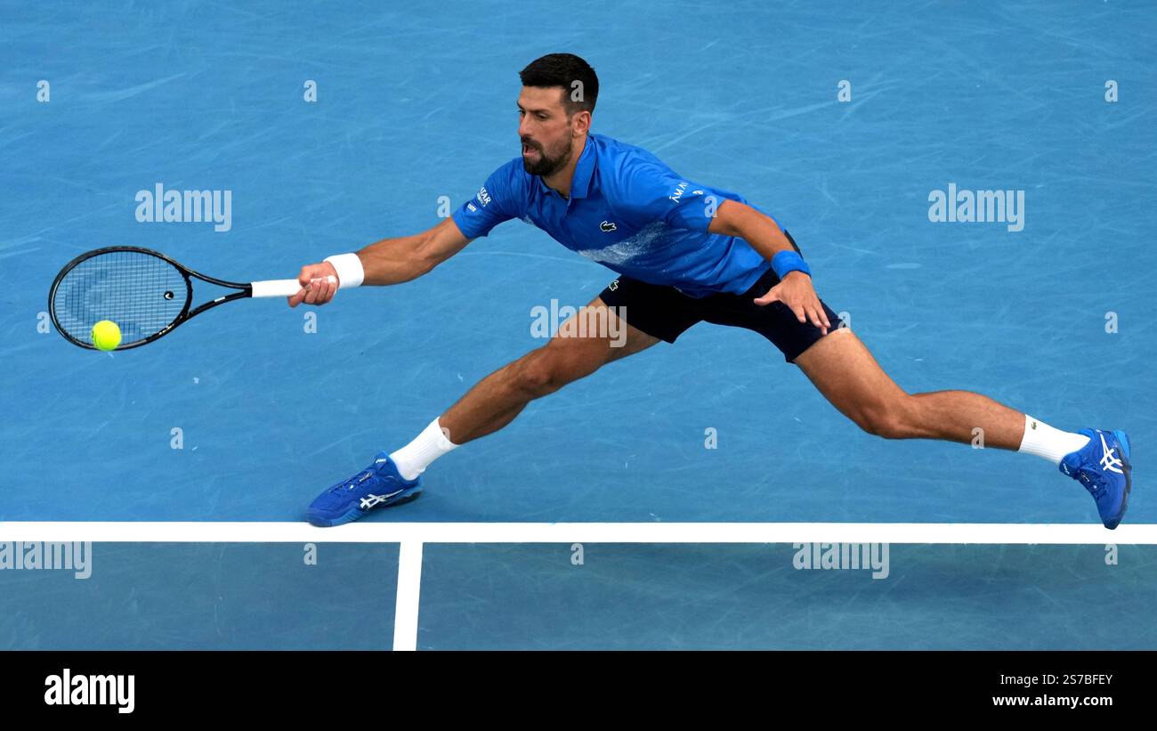 Novak Djokovic of Serbia returns a shot from Jiri Lehecka of the Czech ...