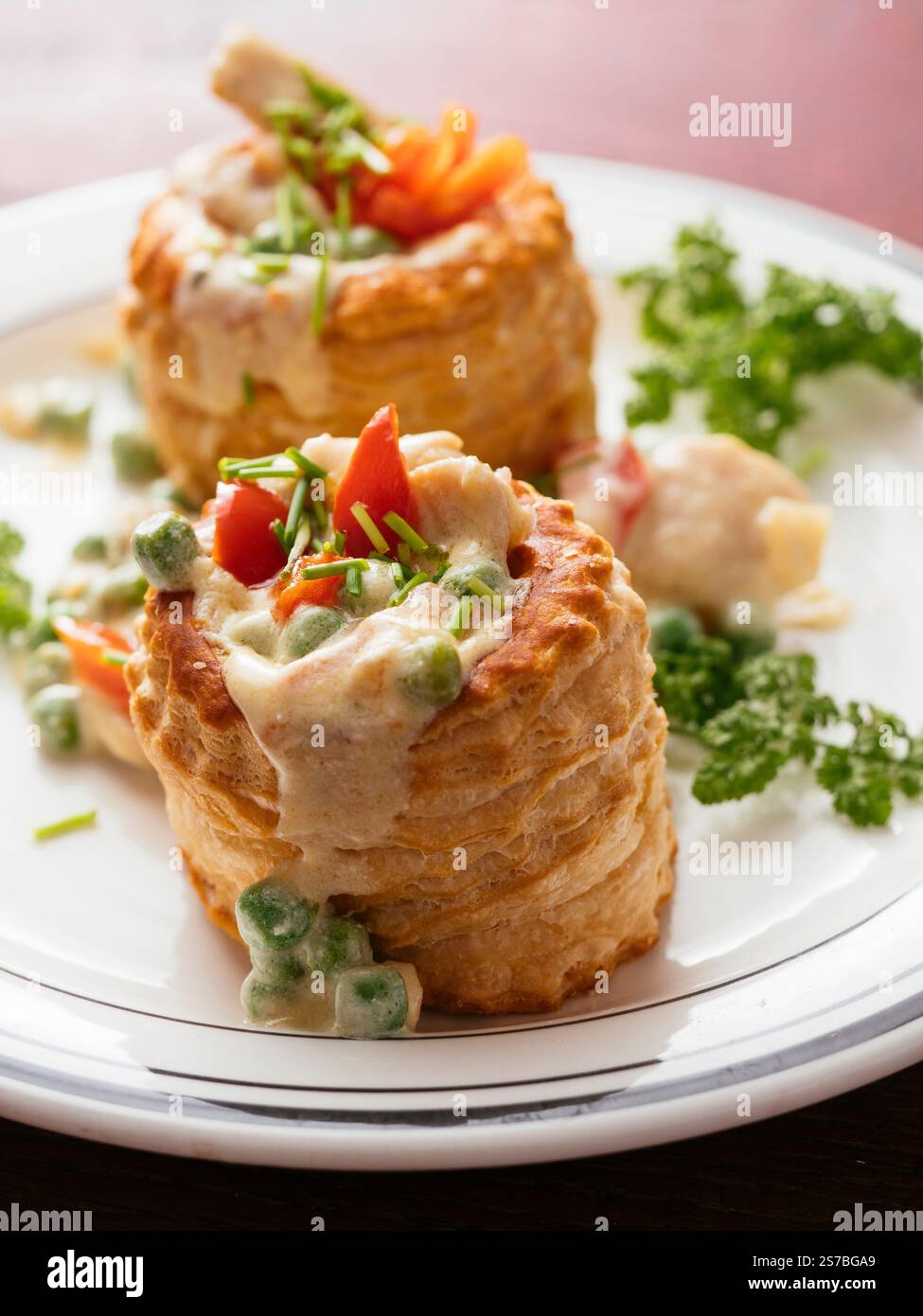Vegan puff pastry shells filled with a creamy chickun, peas and bell ...