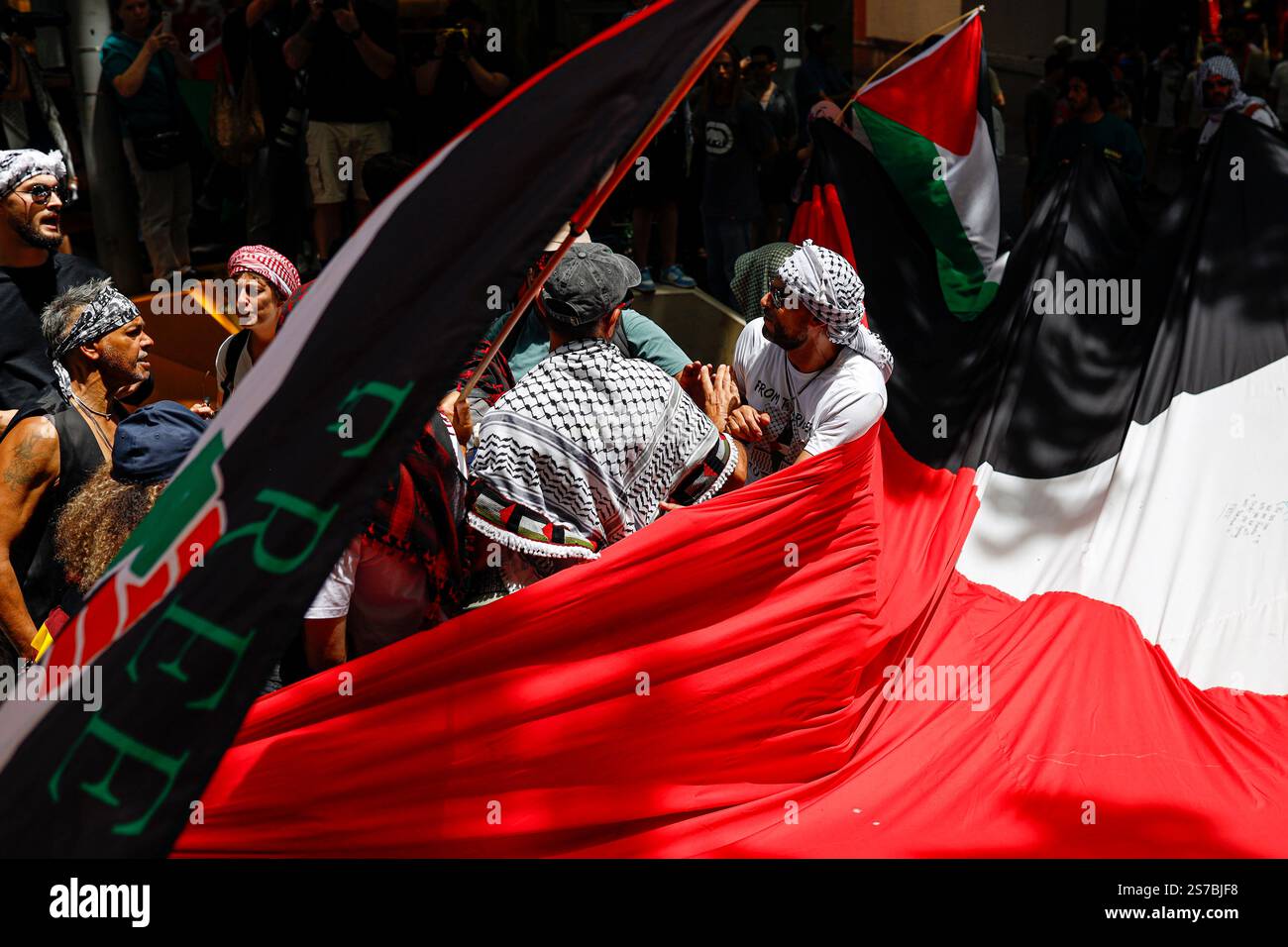 Melbourne, Australia. 19th Jan, 2025. Protesters argue with local ...