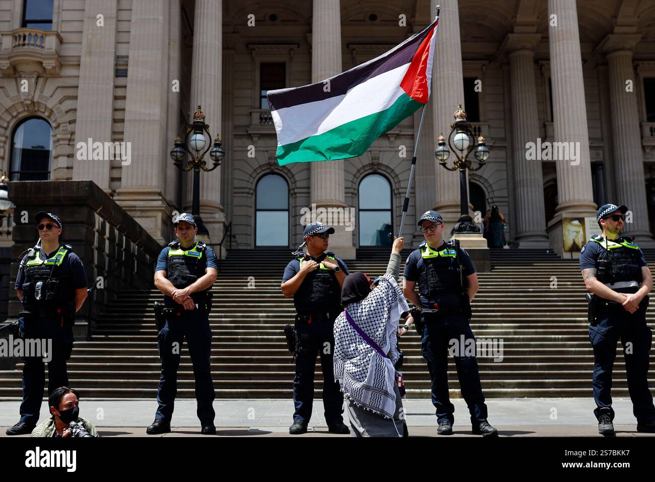 Melbourne, Australia. 19th Jan, 2025. A protester waving a Palestine ...