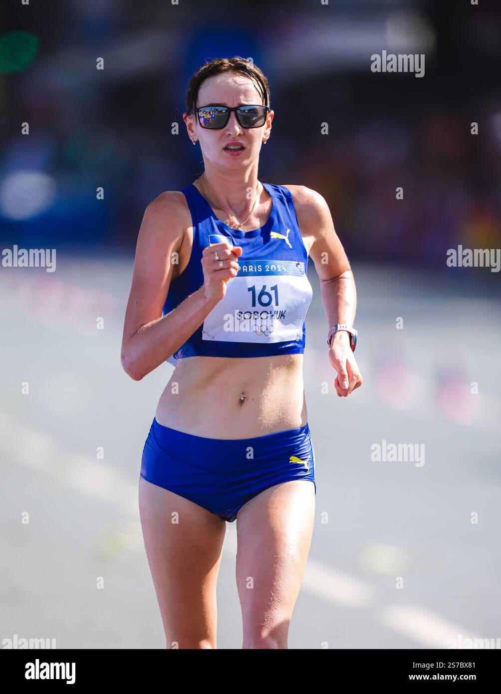 Olena Sobchuk participating in the 20 Kilometer Race Walk at the Paris 2024 Olympic Games with ...