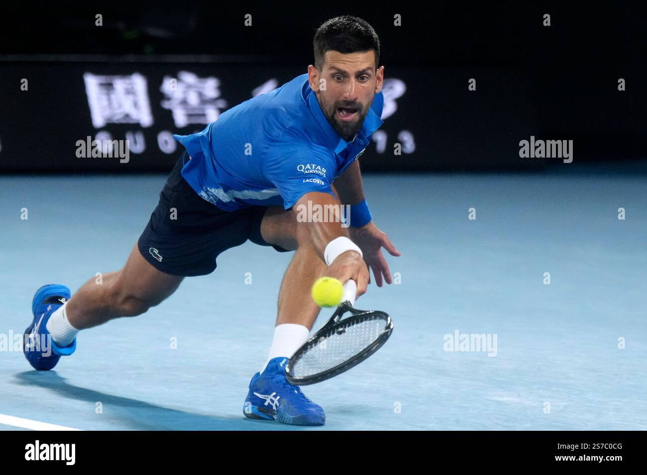 Novak Djokovic of Serbia returns a shot from Jiri Lehecka of the Czech ...