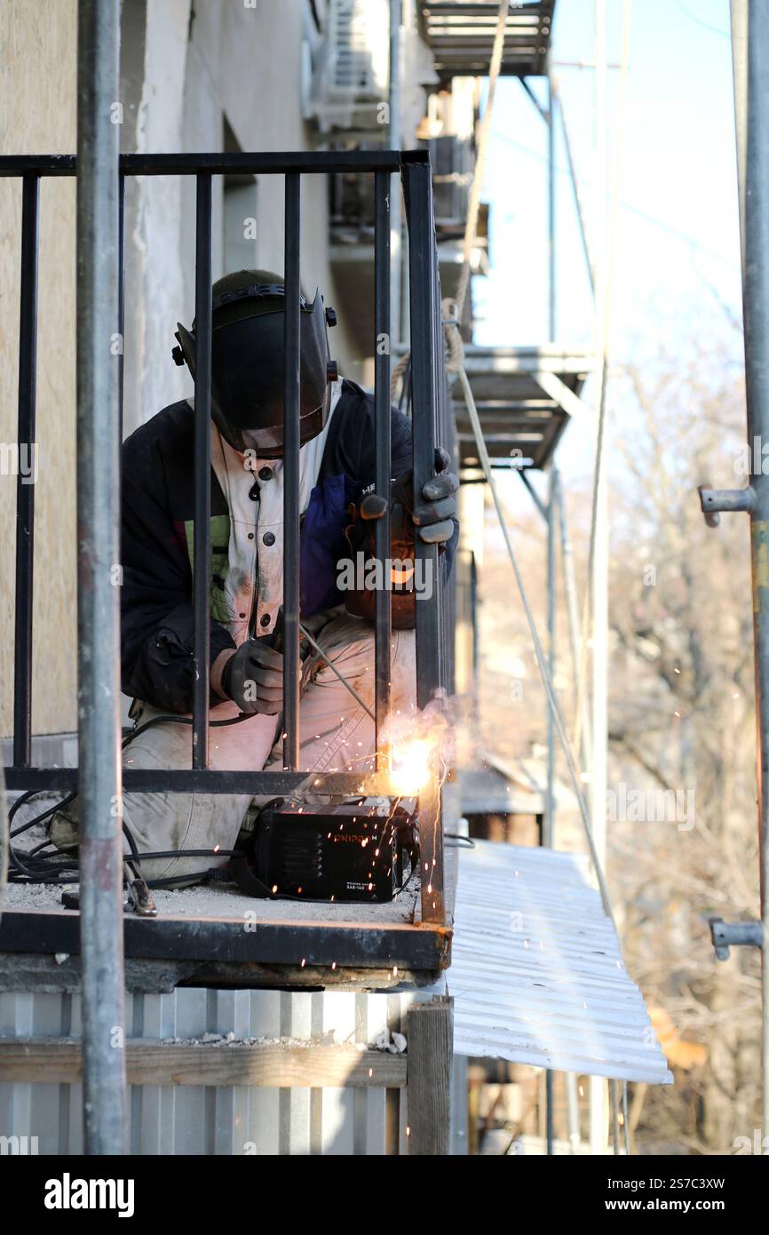 Odessa, Ukraine. 14th Jan, 2025. A welder does his job on the facade of ...