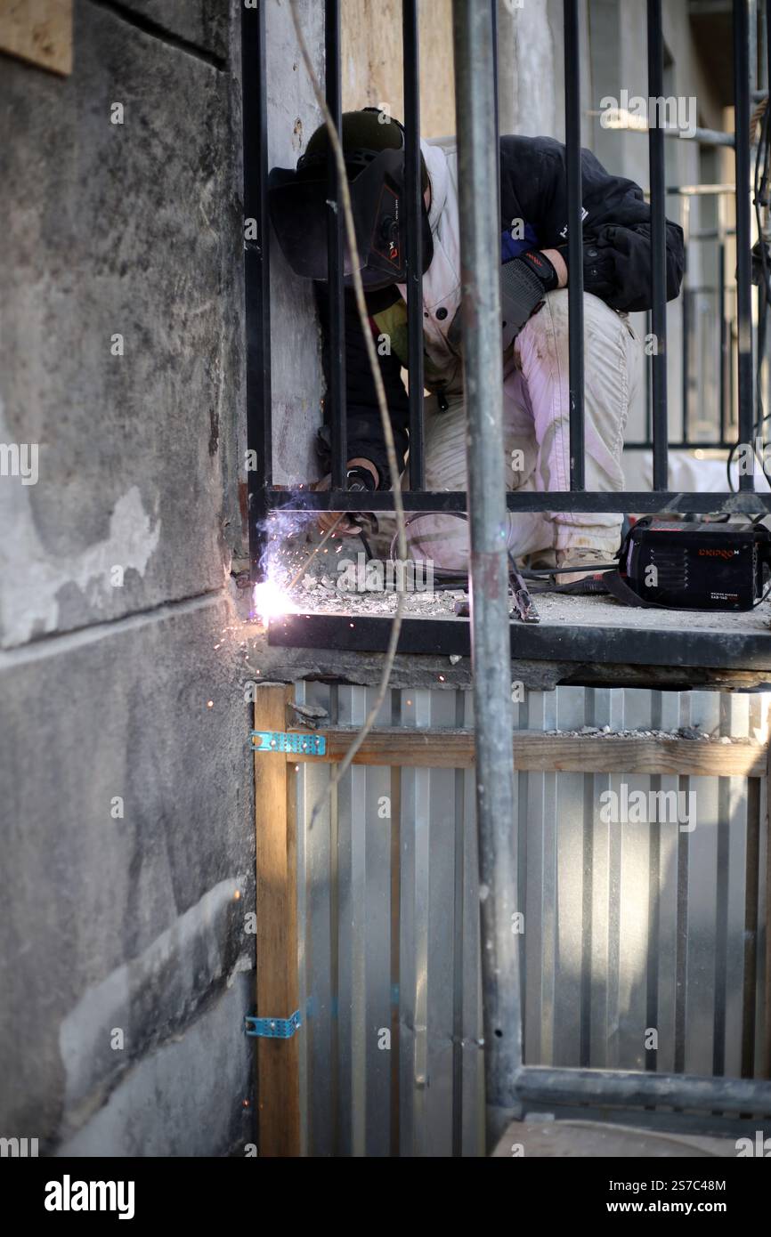 Odessa, Ukraine. 14th Jan, 2025. A welder does his job on the facade of ...
