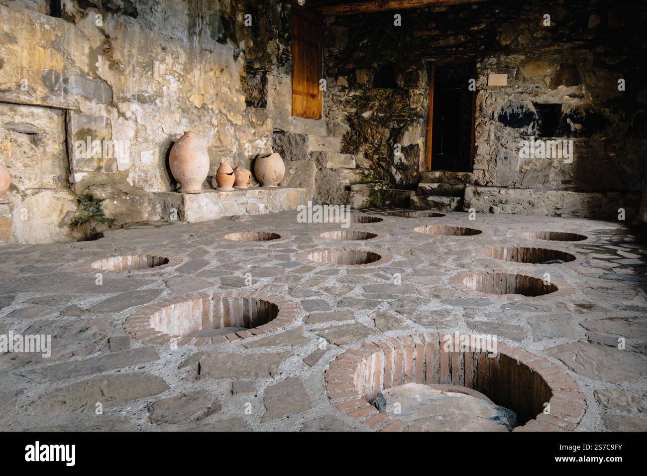 ancient wine cellar at nekresi monastery, georgia. traditional qvevri pits for winemaking Stock ...