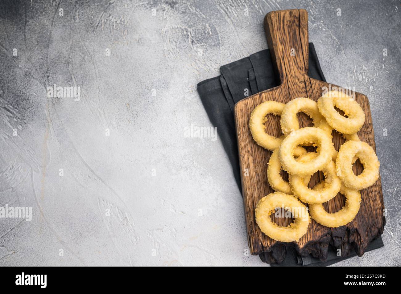 Raw and frozen squid rings with breading, uncooked calamari snack ...