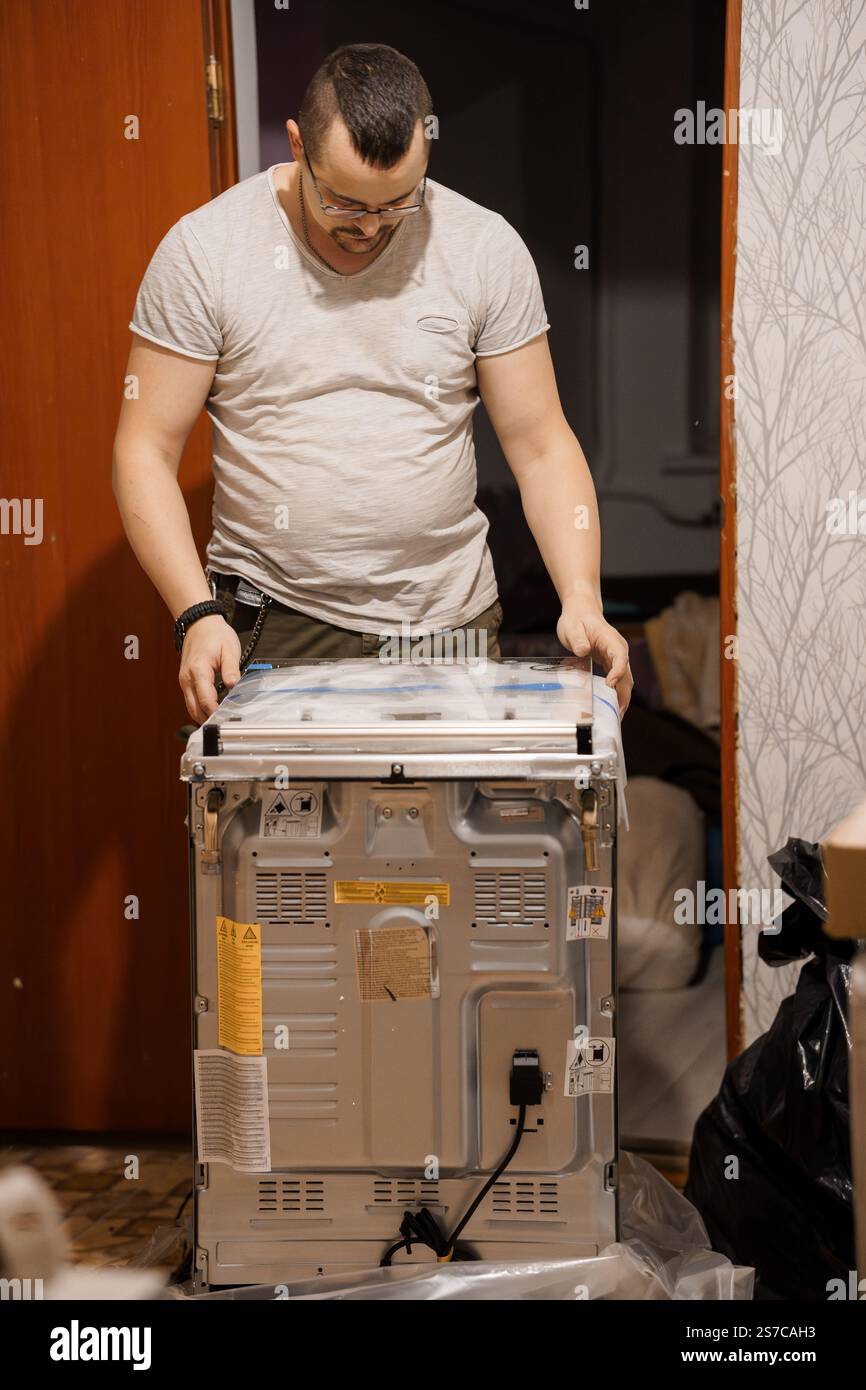 Man Assembling a Kitchen Appliance in a Modern Home Setting Stock Photo ...
